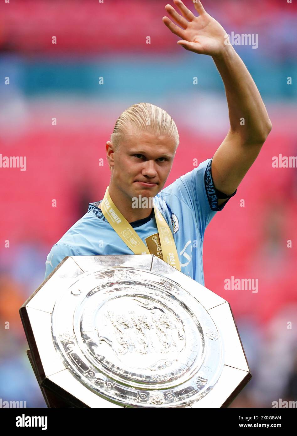 Manchester City's Erling Haaland celebrates with the trophy after ...