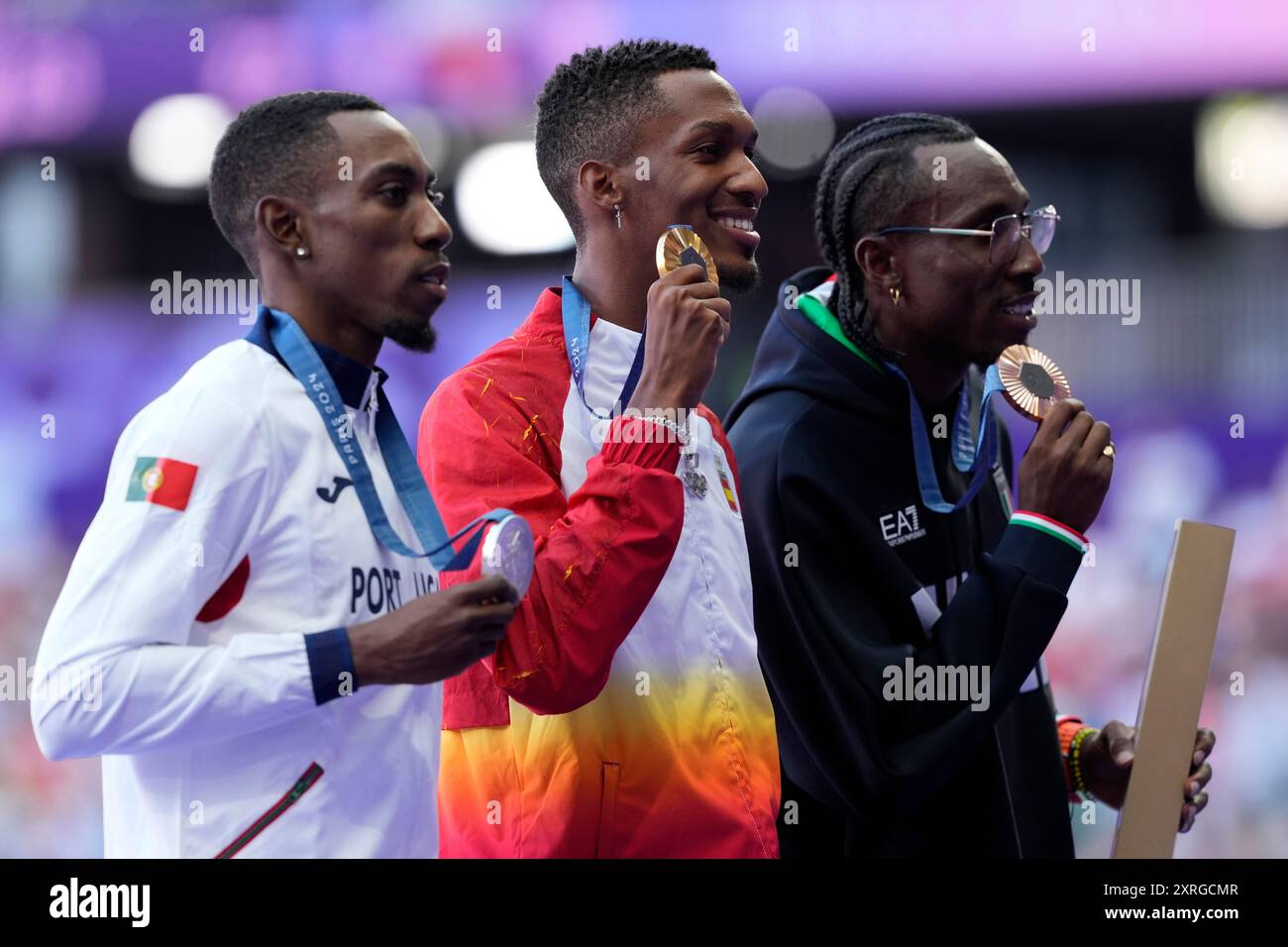 Men's triple jump gold medalist, Jordan Alejandro Diaz Fortun, centre, of Spain, stands with ...