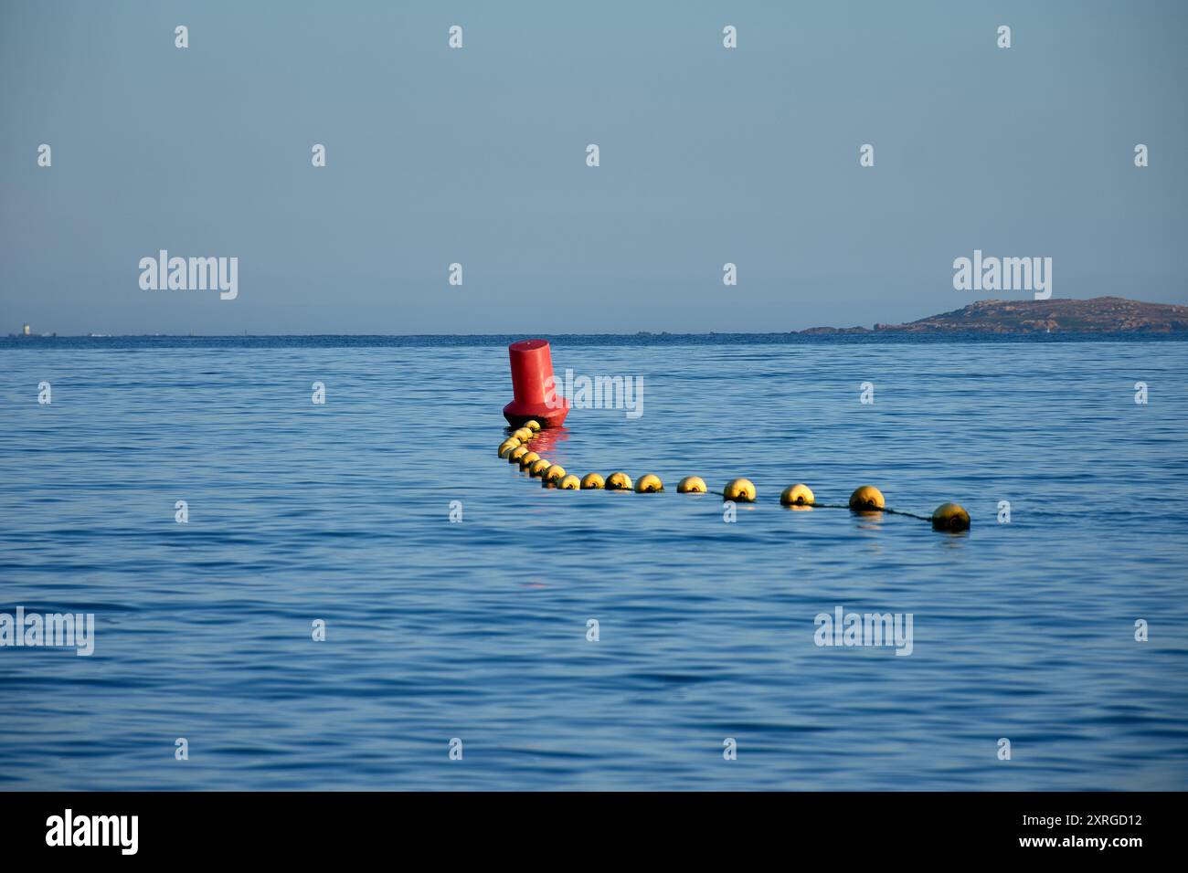 the designated swimming area on a beach, clearly marked by a line of ...