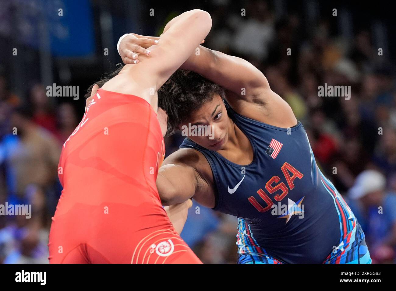Kyrgyzstan's Aiperi Medet Kyzy, in red, and Kennedy Alexis Blades, of ...
