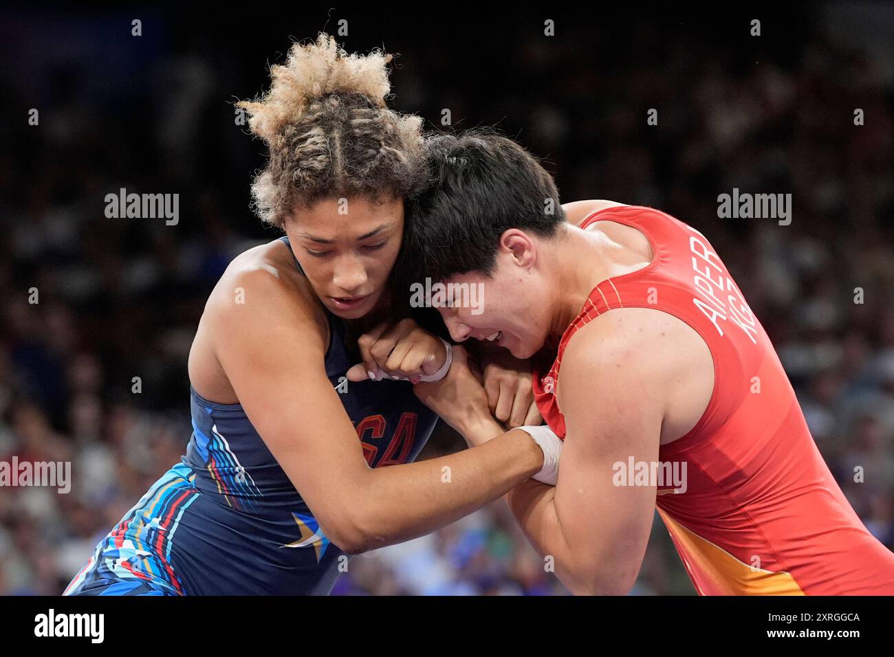 Kyrgyzstan's Aiperi Medet Kyzy, in red, and Kennedy Alexis Blades, of ...