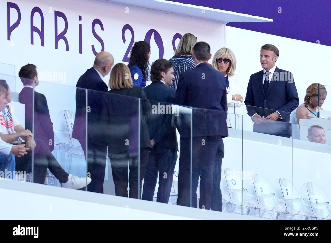 French President Emmanuel Macron, at right, and his wife Brigitte ...