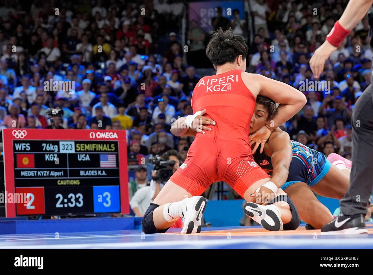 Kyrgyzstan's Aiperi Medet Kyzy, in red, and Kennedy Alexis Blades, of ...