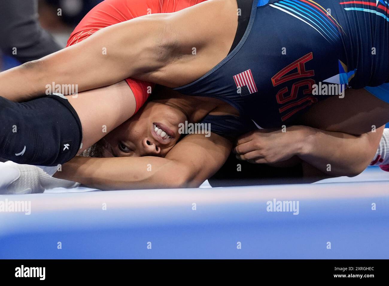 Kyrgyzstan's Aiperi Medet Kyzy, in red, and Kennedy Alexis Blades, of ...
