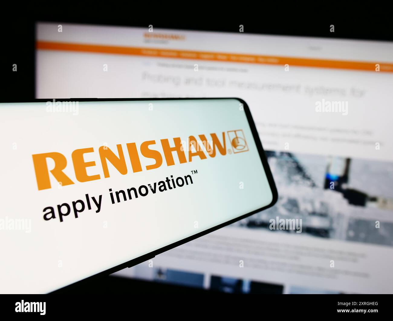 Mobile phone with logo of British engineering company Renishaw plc in ...