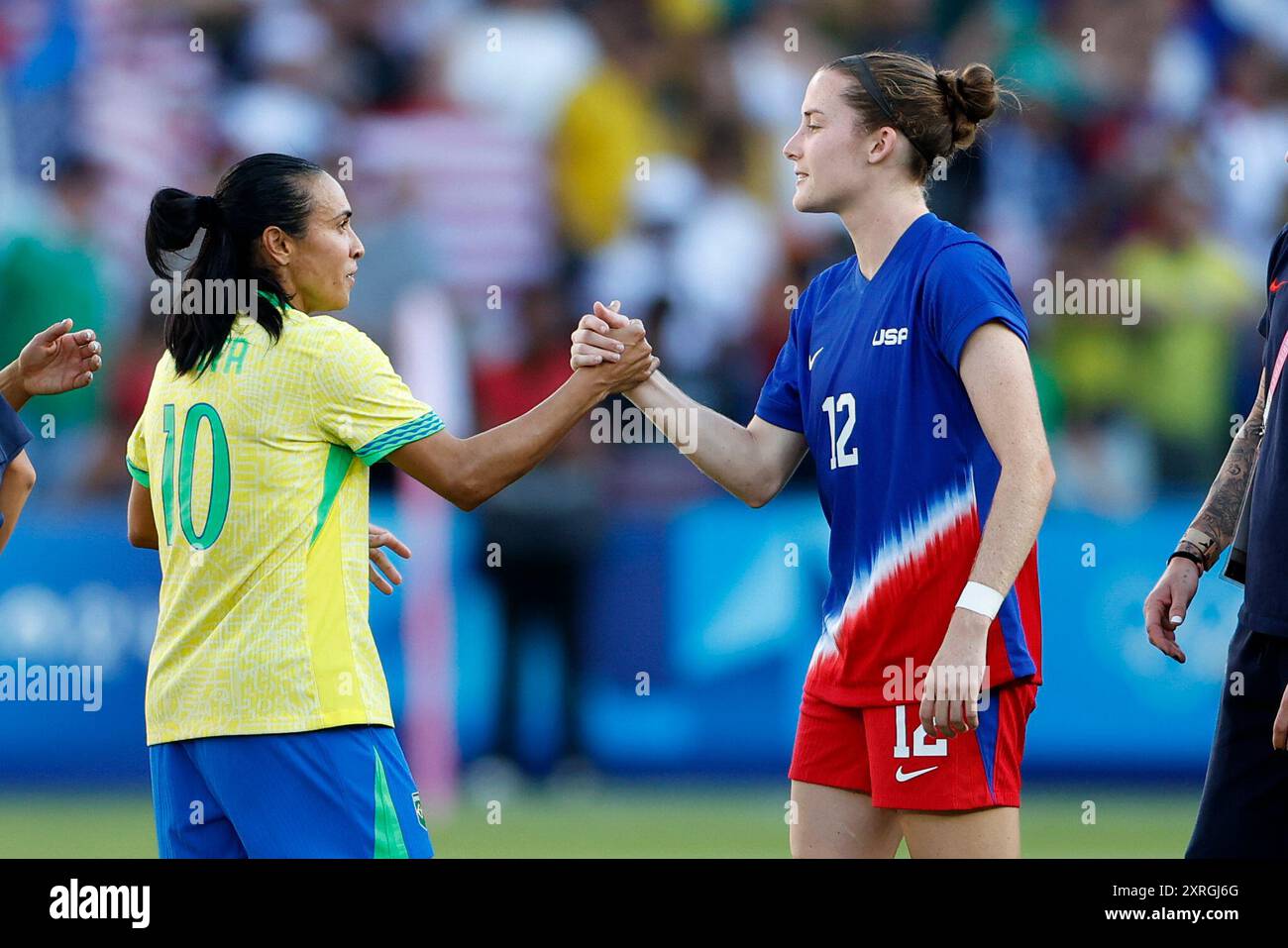 Brazil's Marta, left, greets Tierna Davidson of the United States the ...