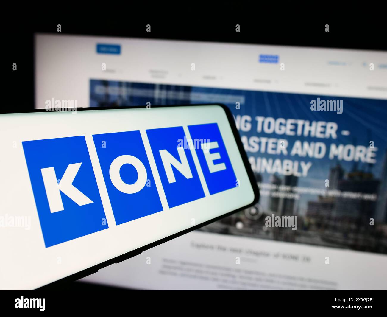 Mobile phone with logo of Finnish elevator engineering company Kone Oyj ...