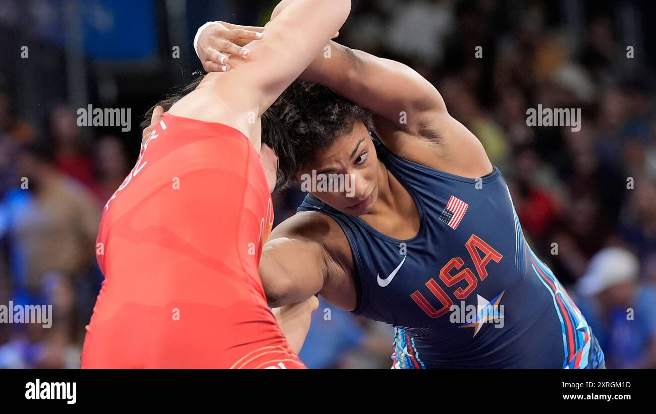 Kyrgyzstan's Aiperi Medet Kyzy, in red, and Kennedy Alexis Blades, of ...