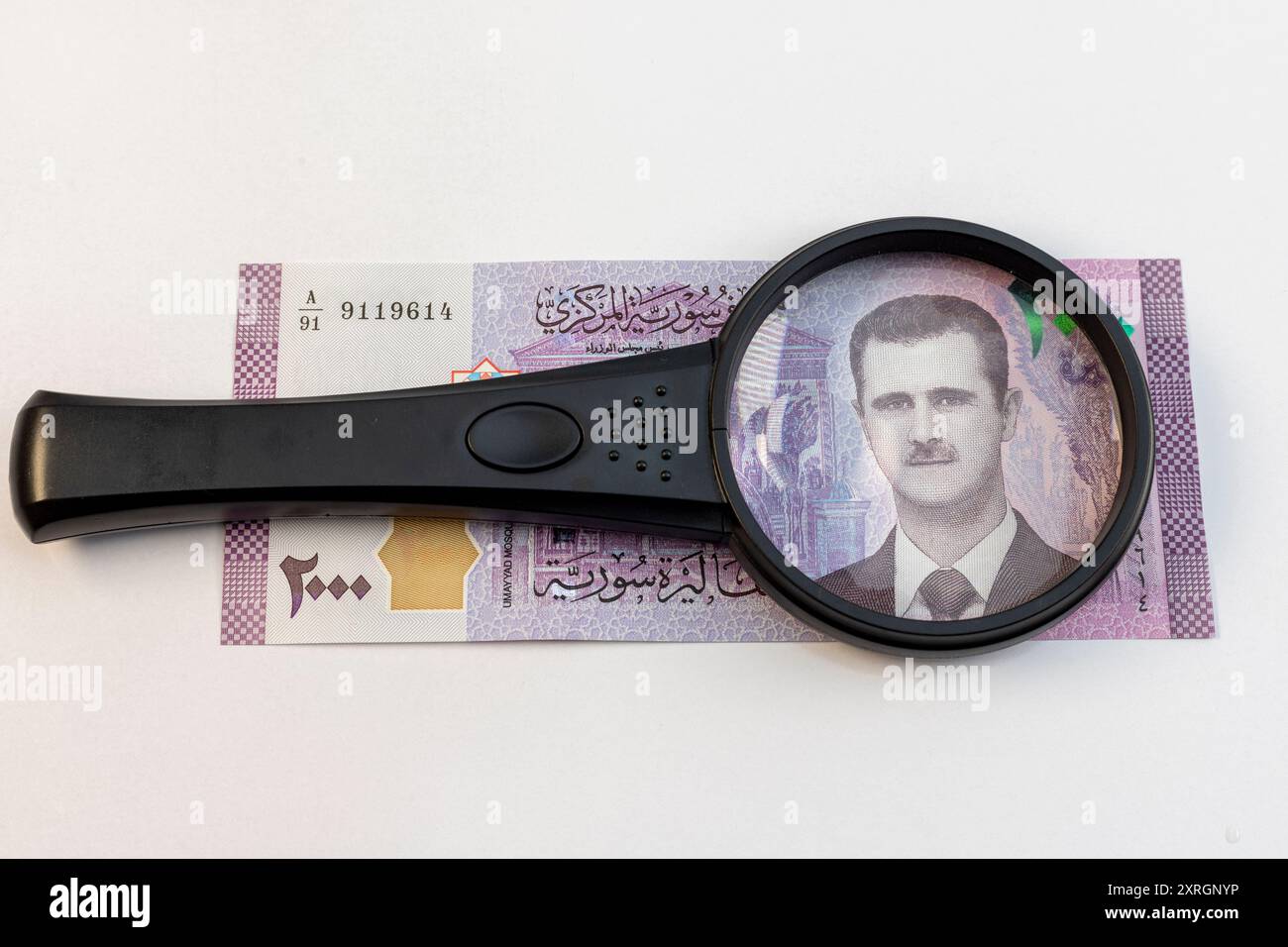 Magnifying glass focused on President Bashar Al Assad, portrait from ...