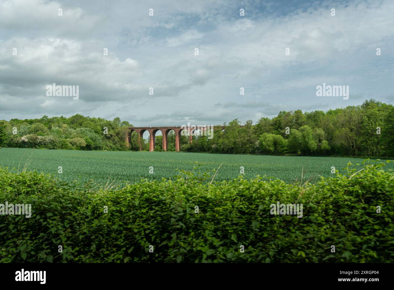 View across a farmers field of the disused Ledbury viaduct ...