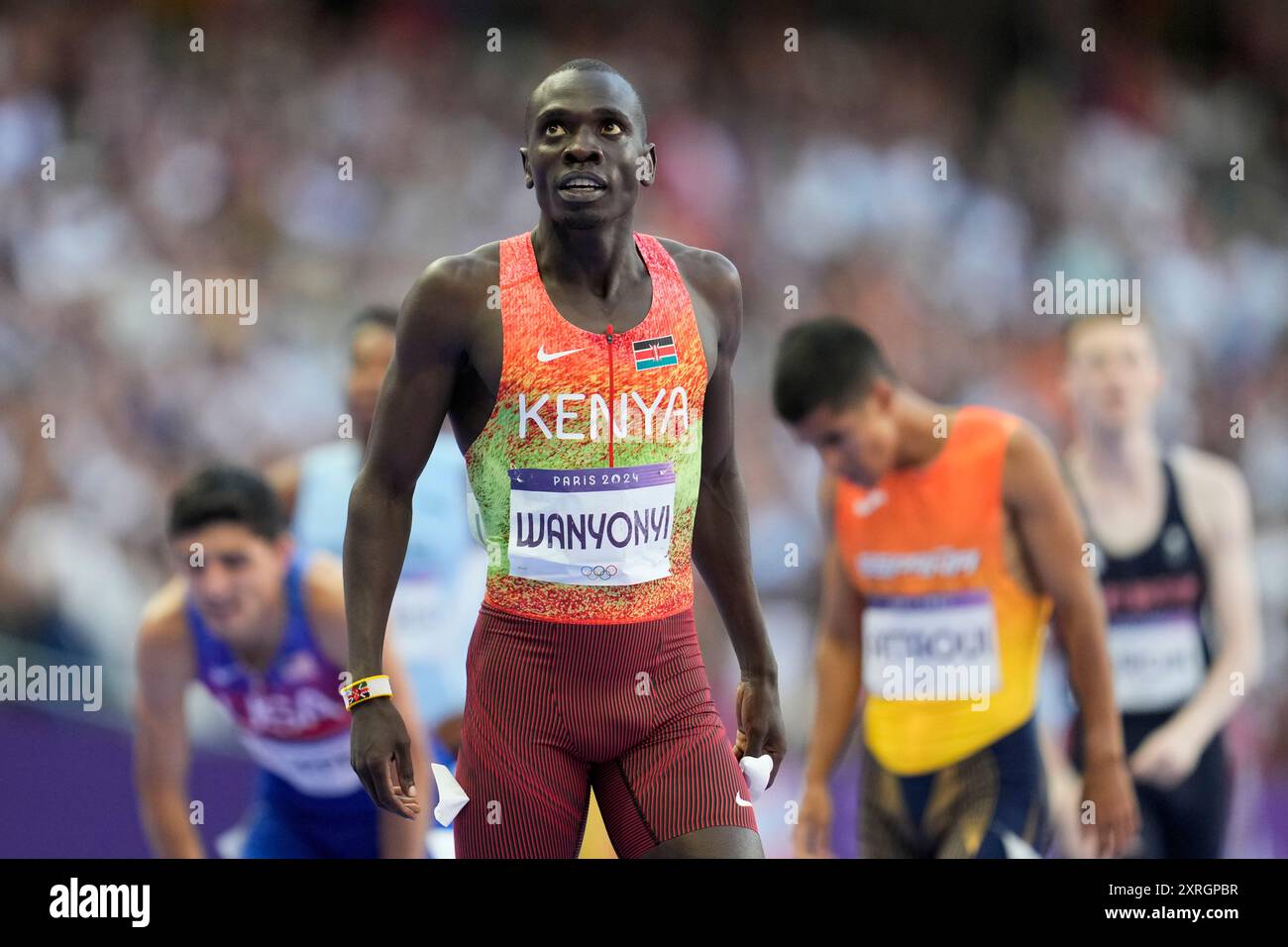 Emmanuel Wanyonyi, of Kenya, looks up for the results after winning the ...