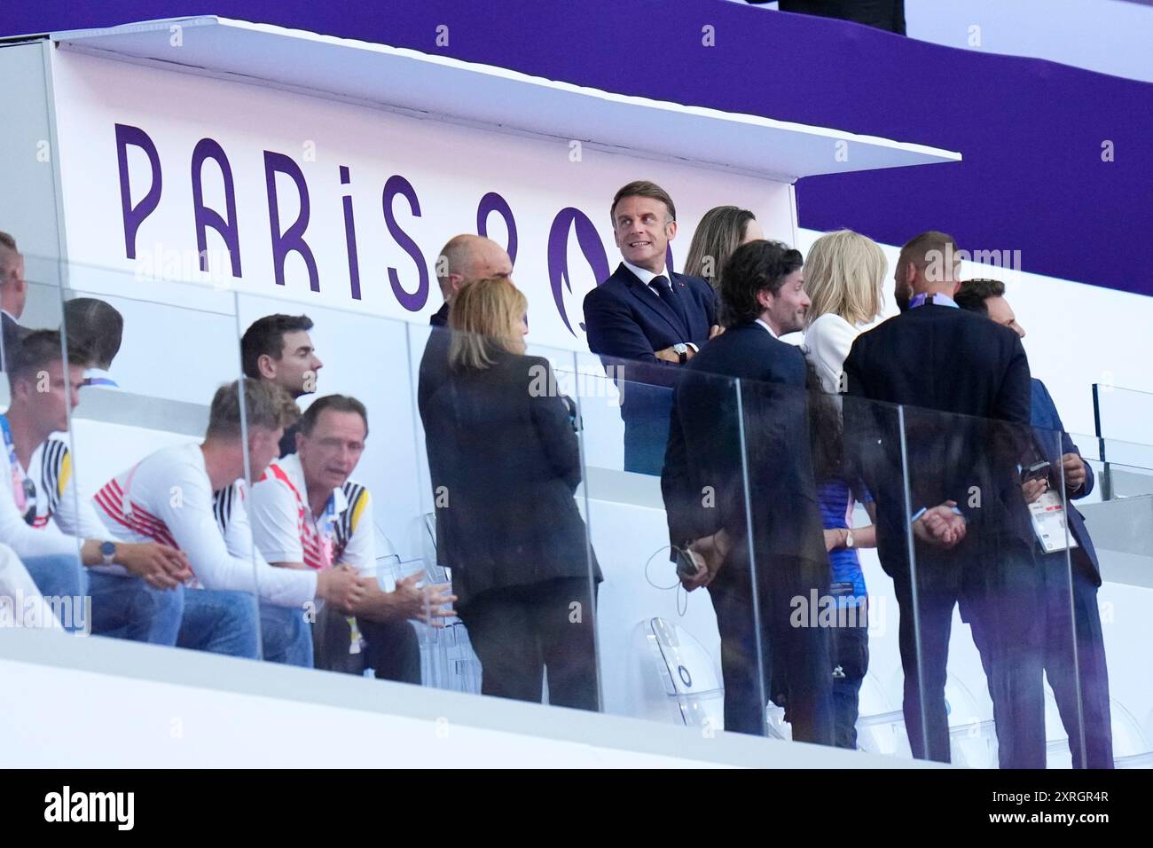 French President Emmanuel Macron, at right, and his wife Brigitte ...