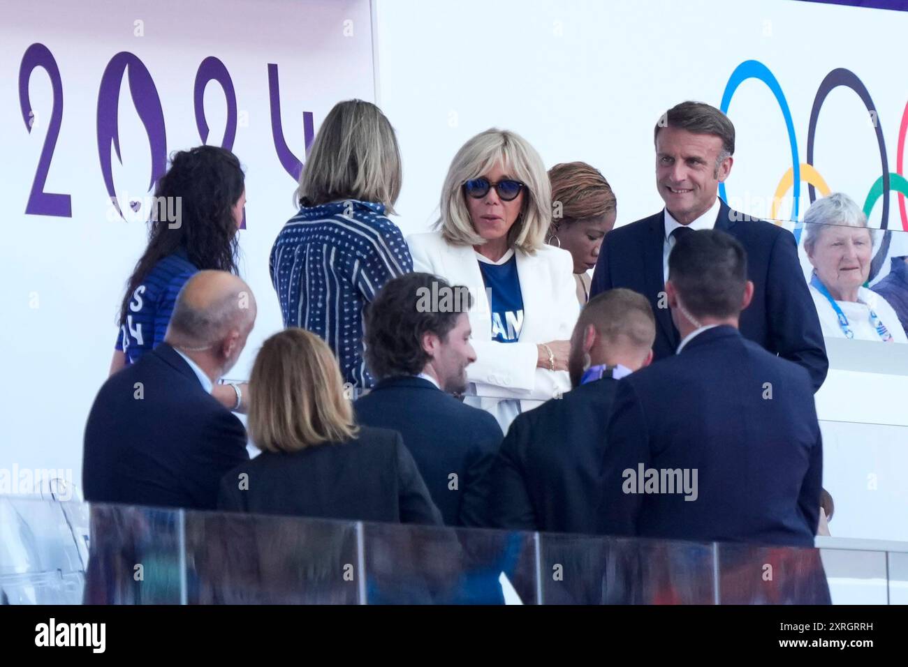 French President Emmanuel Macron, at right, and his wife Brigitte ...