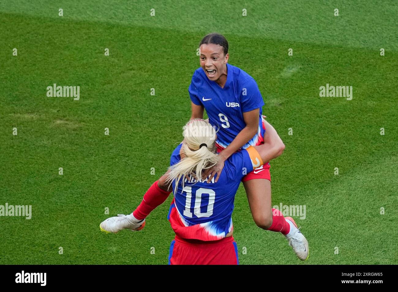 Mallory Swanson, of the United States, up, celebrates with Lindsey ...