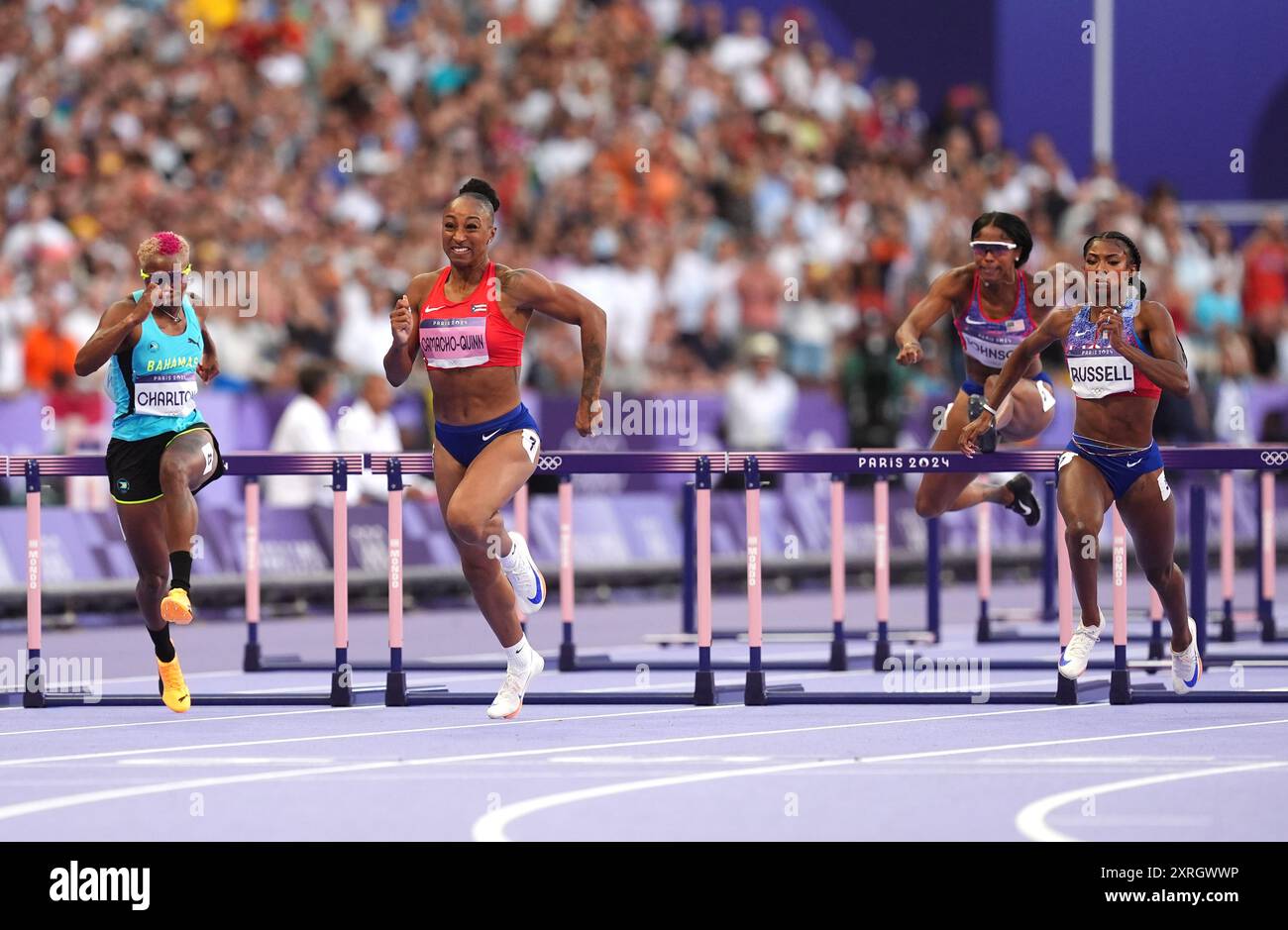 USA's Masai Russell (right) finishes first in the Women's 100m Hurdles ...