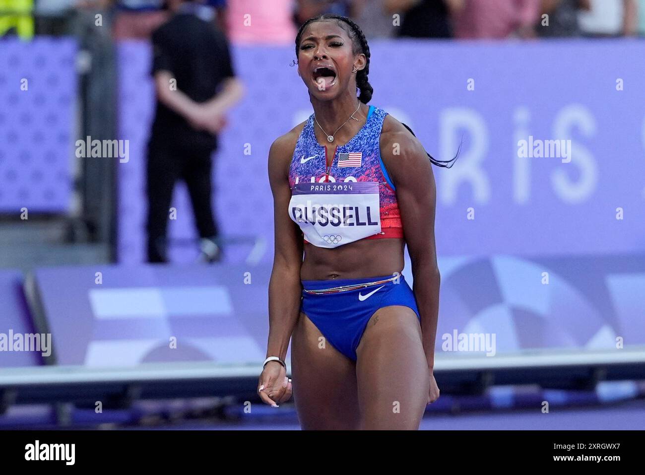 Masai Russell, of the United States, reacts after winning the women's ...