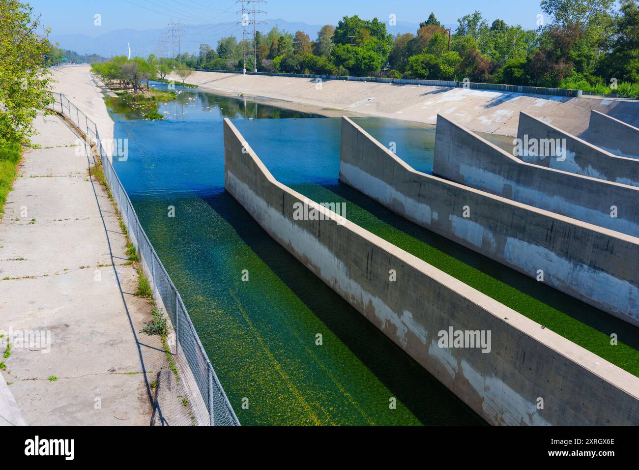 Aerial view of Los Angeles River showcasing concrete channels and green ...