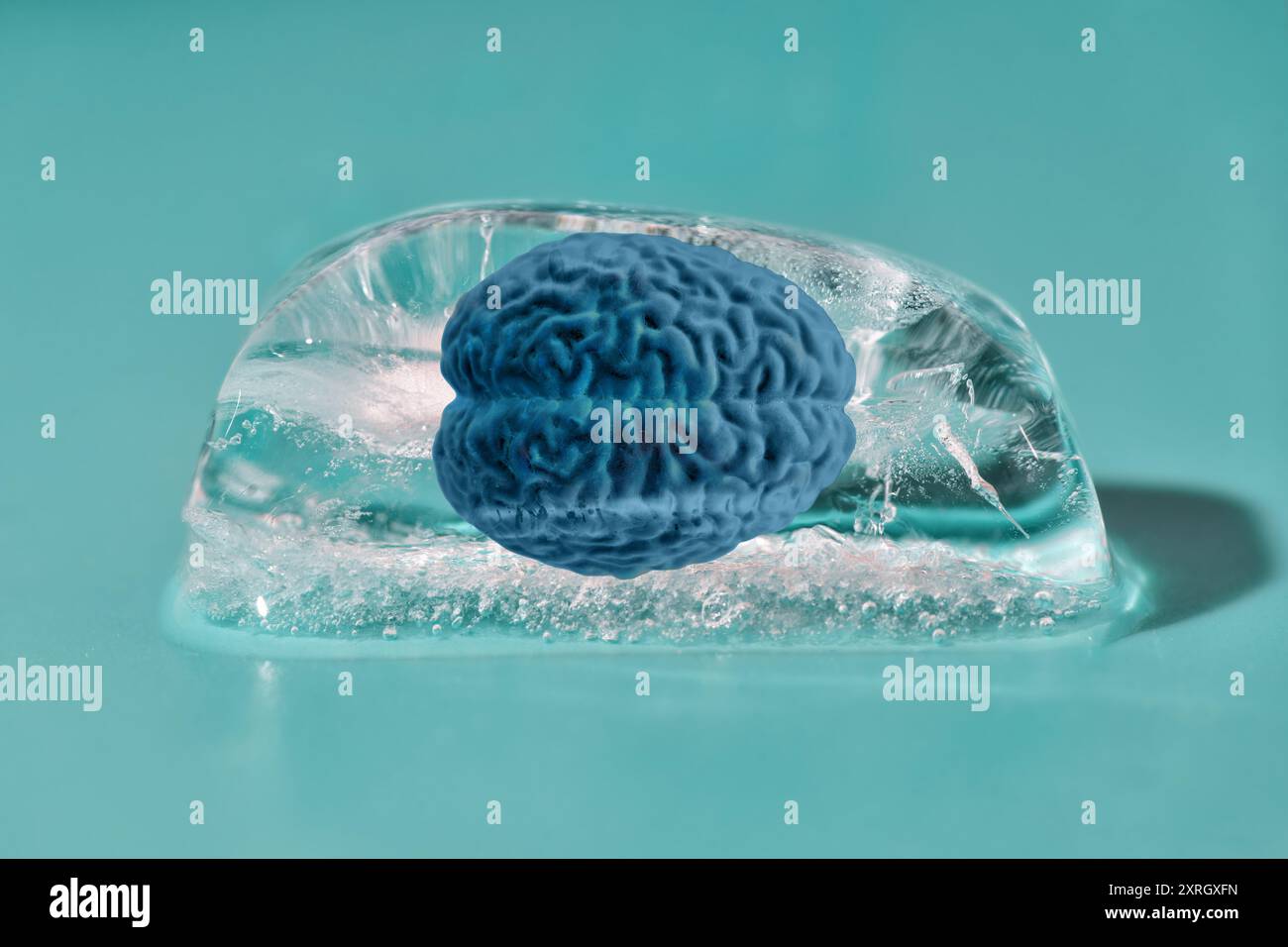 Human brain encased in ice cube on teal background, symbolizing trapped ...