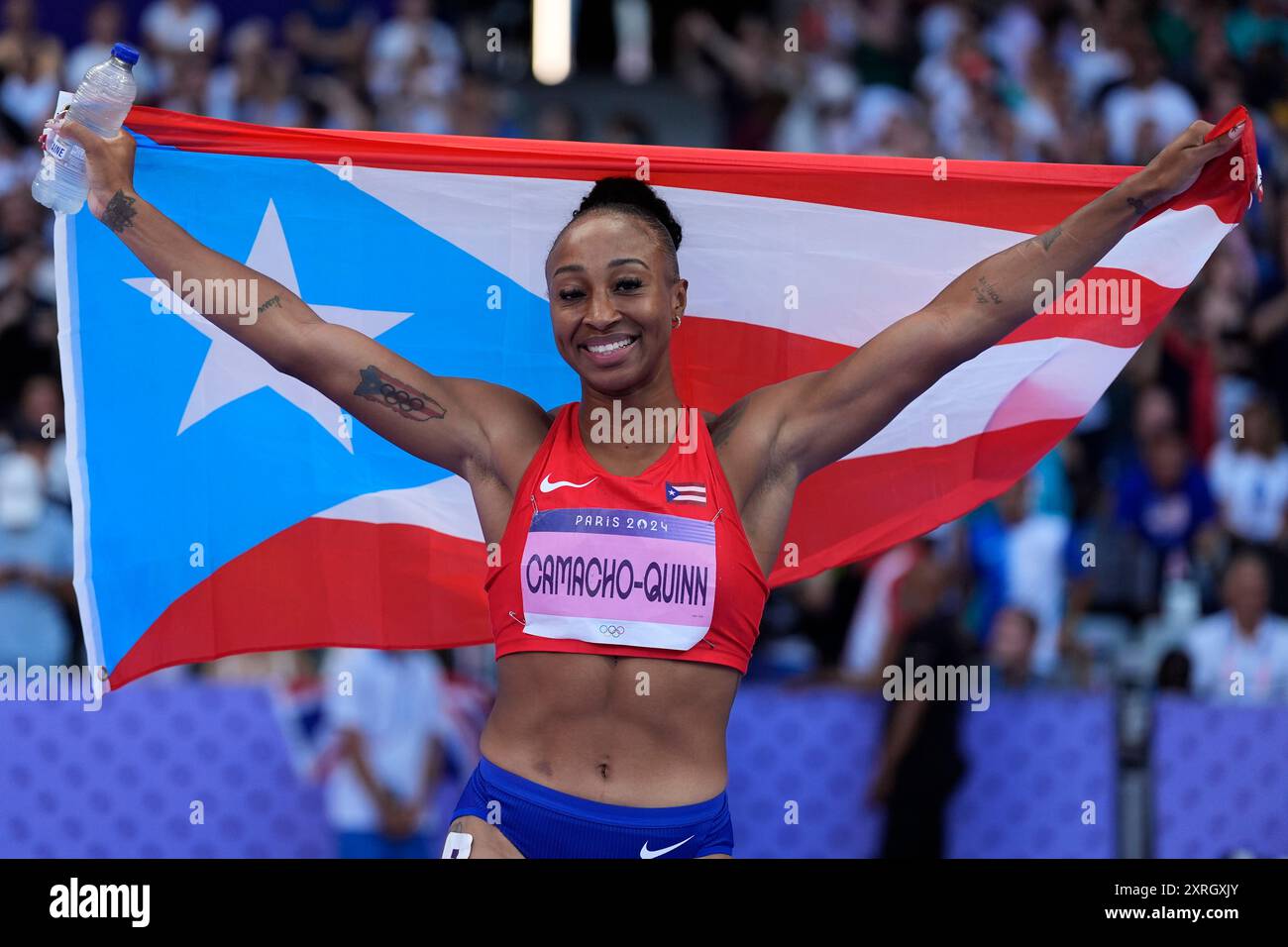 Jasmine Camacho-Quinn, of Puerto Rico, celebrates her third place ...