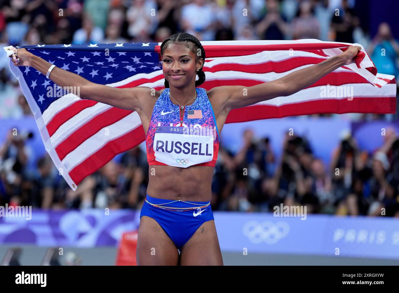 Masai Russell, of the United States, celebrates winning the women's 100 ...