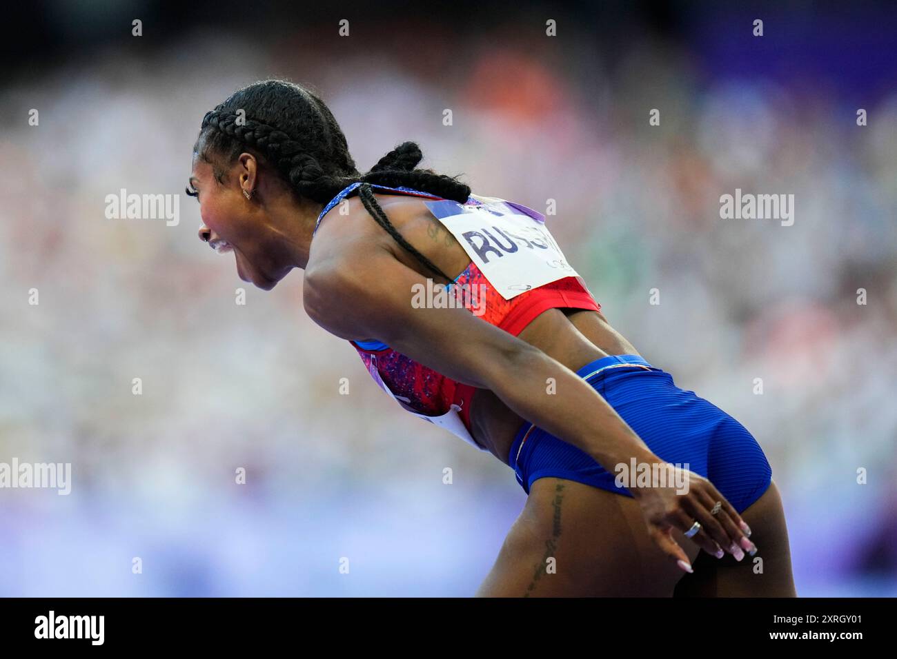 Masai Russell, of the United States, celebrates after winning the women ...