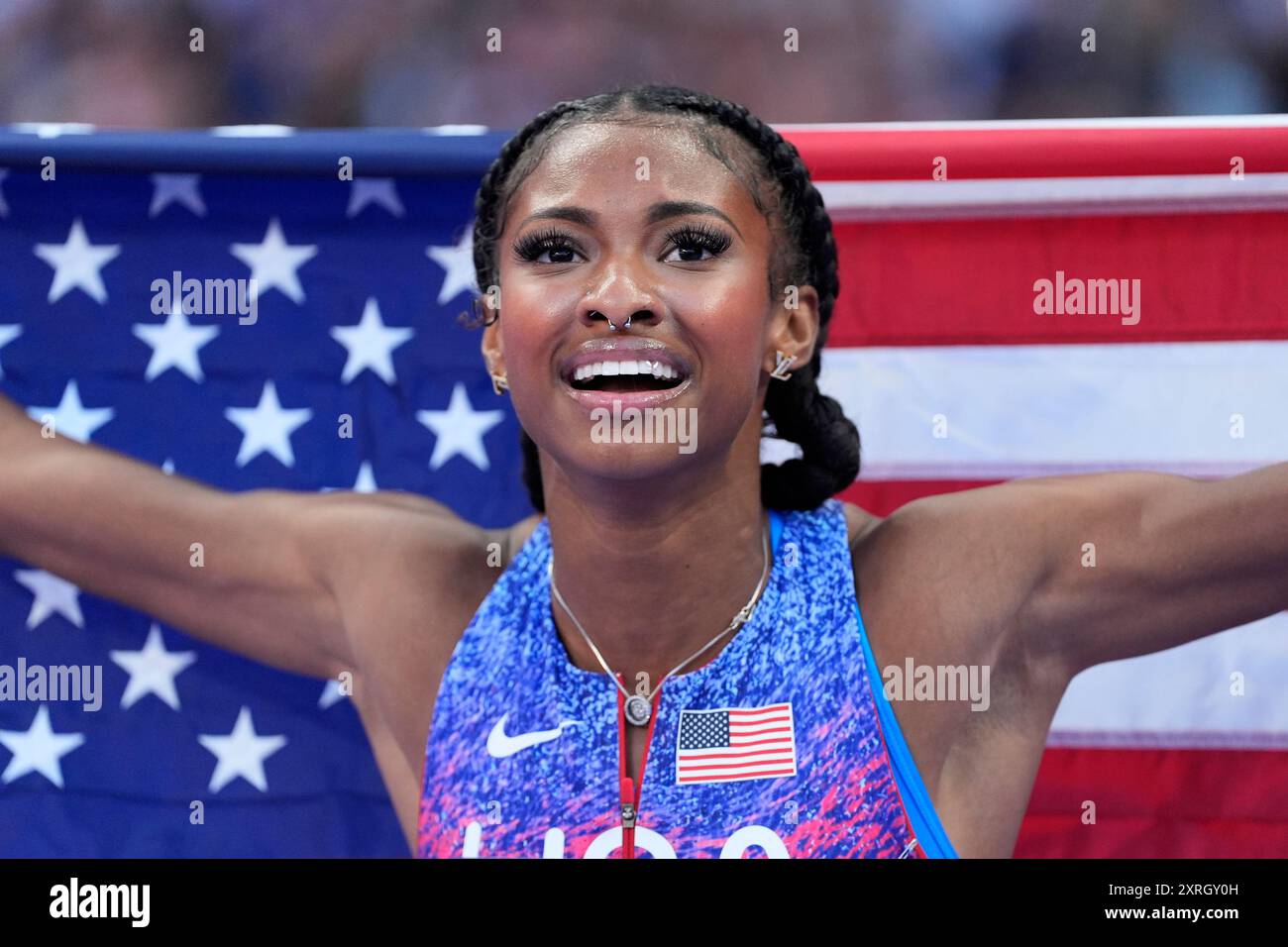 Masai Russell, of the United States, celebrates winning the women's 100 ...