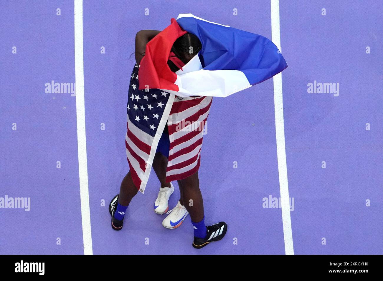 Masai Russell, of the United States, and Cyrena Samba-Mayela, of France ...