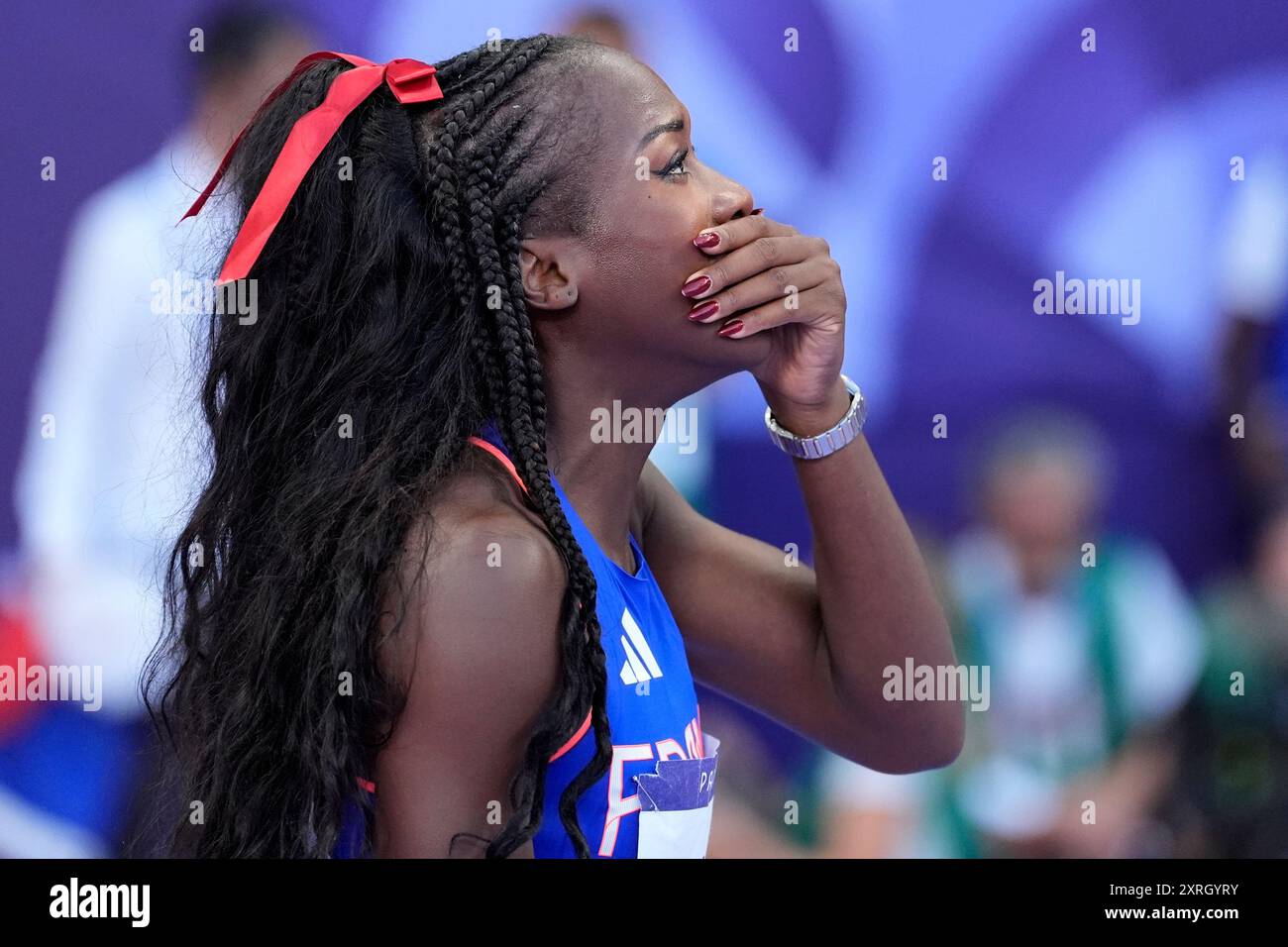 Cyrena Samba-Mayela, of France, reacts to her second place finish in ...