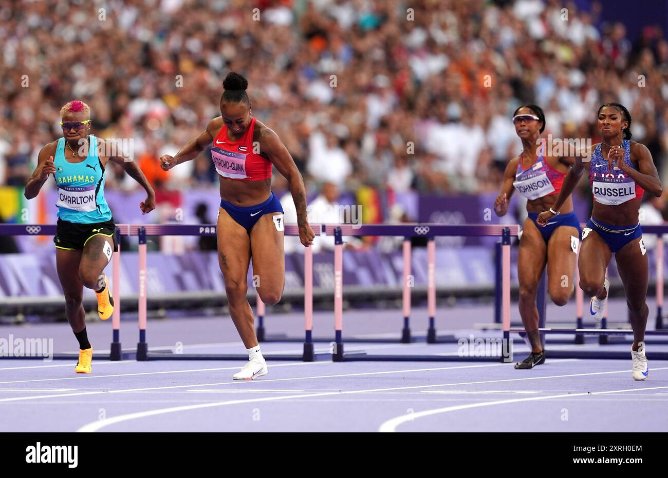 USA's Masai Russell (right) finishes first in the Women's 100m Hurdles ...