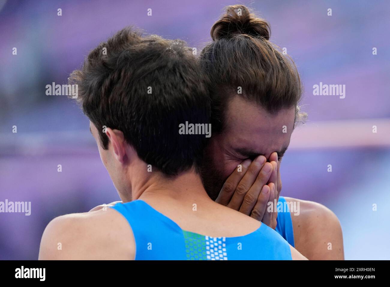 Gianmarco Tamberi, right, of Italy, is consoled by teammate Stefano ...