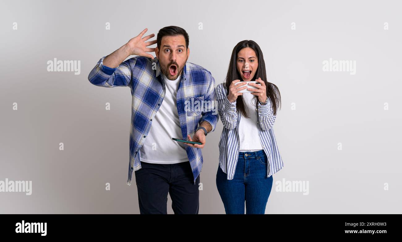 Shocked boyfriend with head in hand looking at camera after losing ...