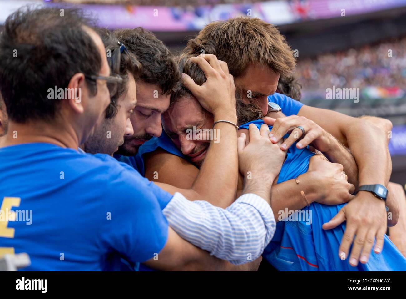 Gianmarco Tamberi, of Italy, center, is consoled by supporters in the ...