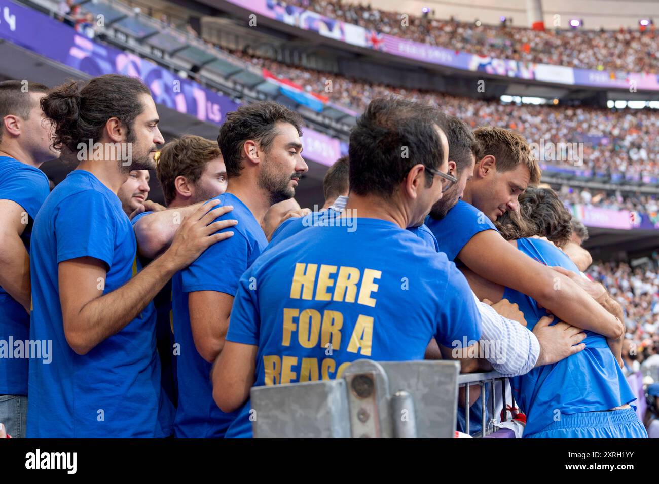 Supporters of Gianmarco Tamberi, of Italy, right, line up to console ...