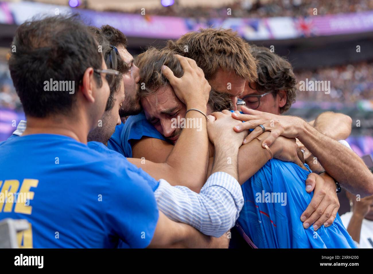 Gianmarco Tamberi, of Italy, center, is consoled by supporters in the ...