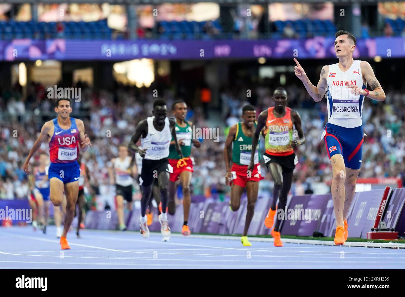 Jakob Ingebrigtsen, of Norway, celebrates after winning the men's 5000 ...