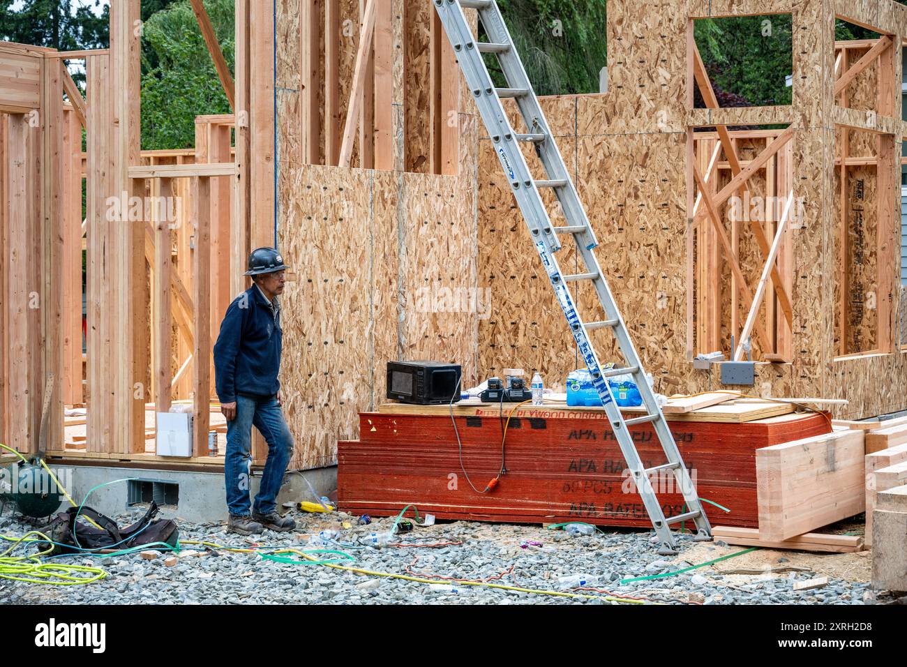 BELLEVUE, WA – JUN 26, 2024: construction crew supervisor taking a ...