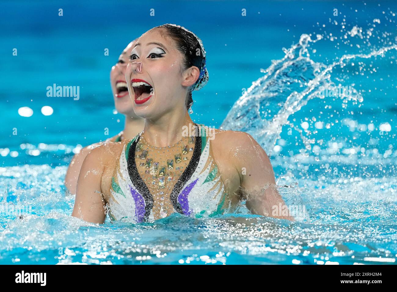 Japan's Moe Higa and Tomoka Sato compete in the duet free routine of artistic swimming at the ...