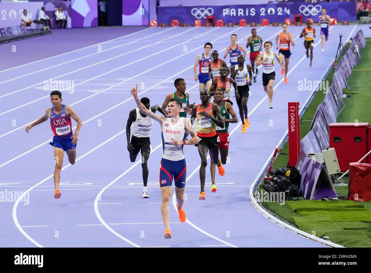Jakob Ingebrigtsen, of Norway, celebrates after winning the men's 5000 ...