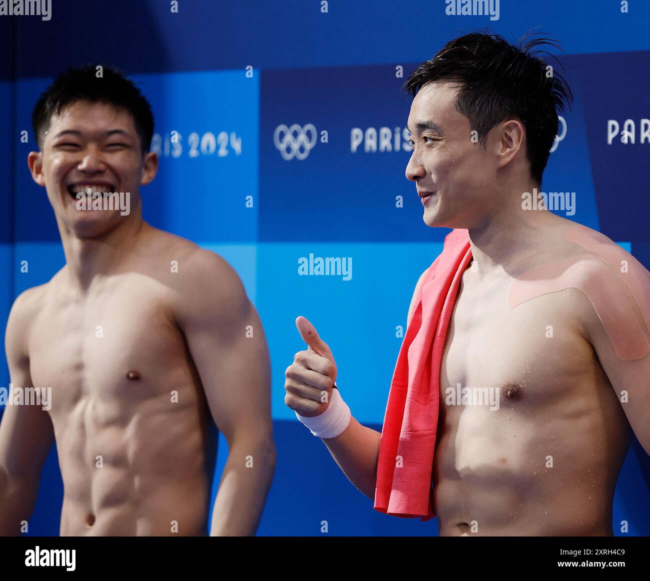 Saint Denis. 10th Aug, 2024. Cao Yuan (R) of China and Tamai Rikuto of Japan react after the men ...