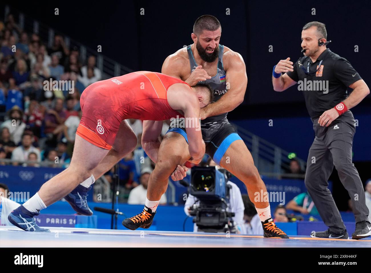 Poland's Robert Baran and Azerbaijan's Giorgi Meshvildishvili compete in their men's freestyle ...