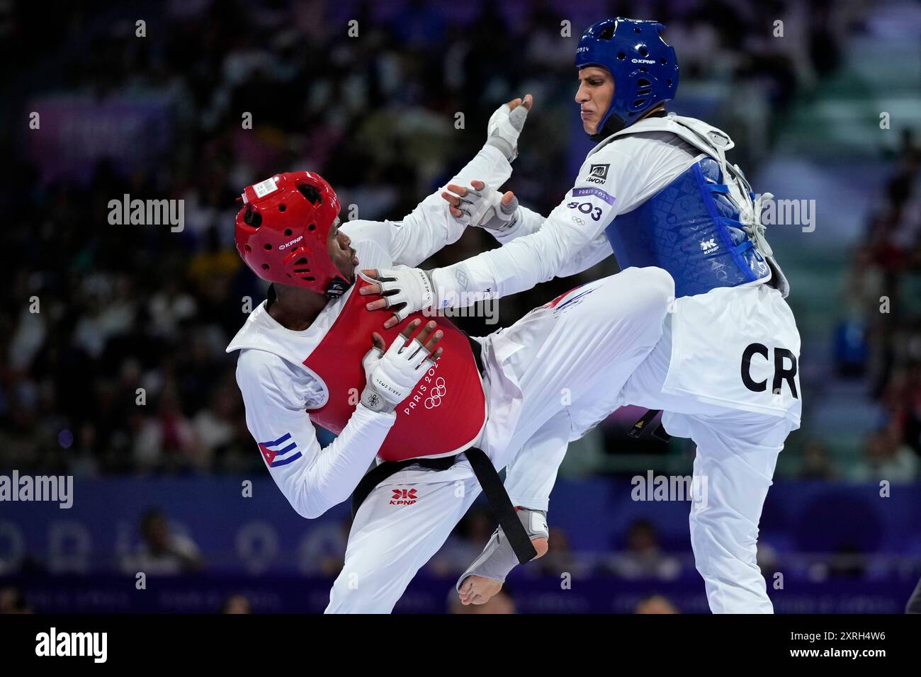 Croatia's Ivan Sapina competes with Cuba's Rafael Alba in a men's +80kg ...