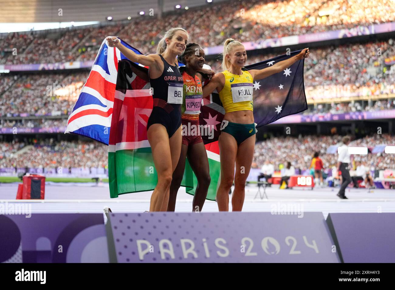 Bronze medalist Georgia Bell, of Britain, gold medalist Faith Kipyegon ...