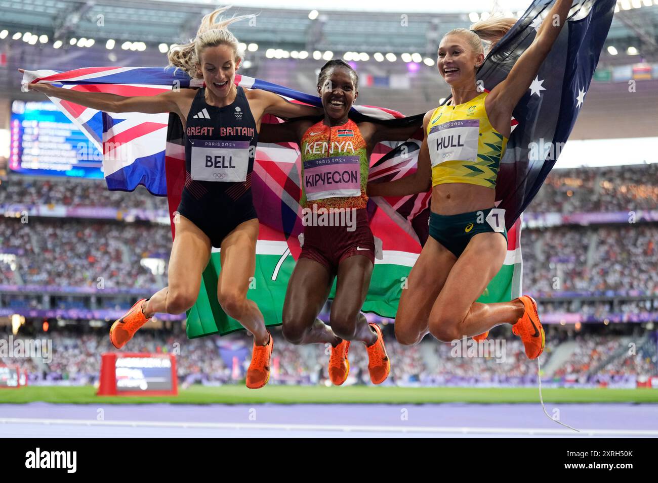 Bronze medalist Georgia Bell, of Britain, gold medalist Faith Kipyegon ...