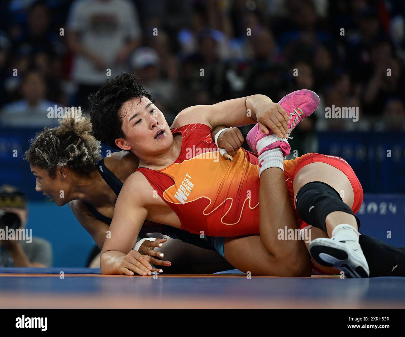 Paris, France. 10th Aug, 2024. Aiperi Medet Kyzy (in red) of Kyrgyzstan ...