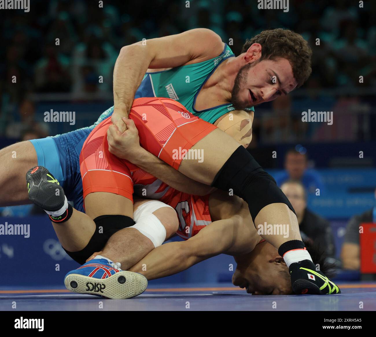 JAMALOV Razambek Salambekovitch (blue) of Uzbekistan fights against ...