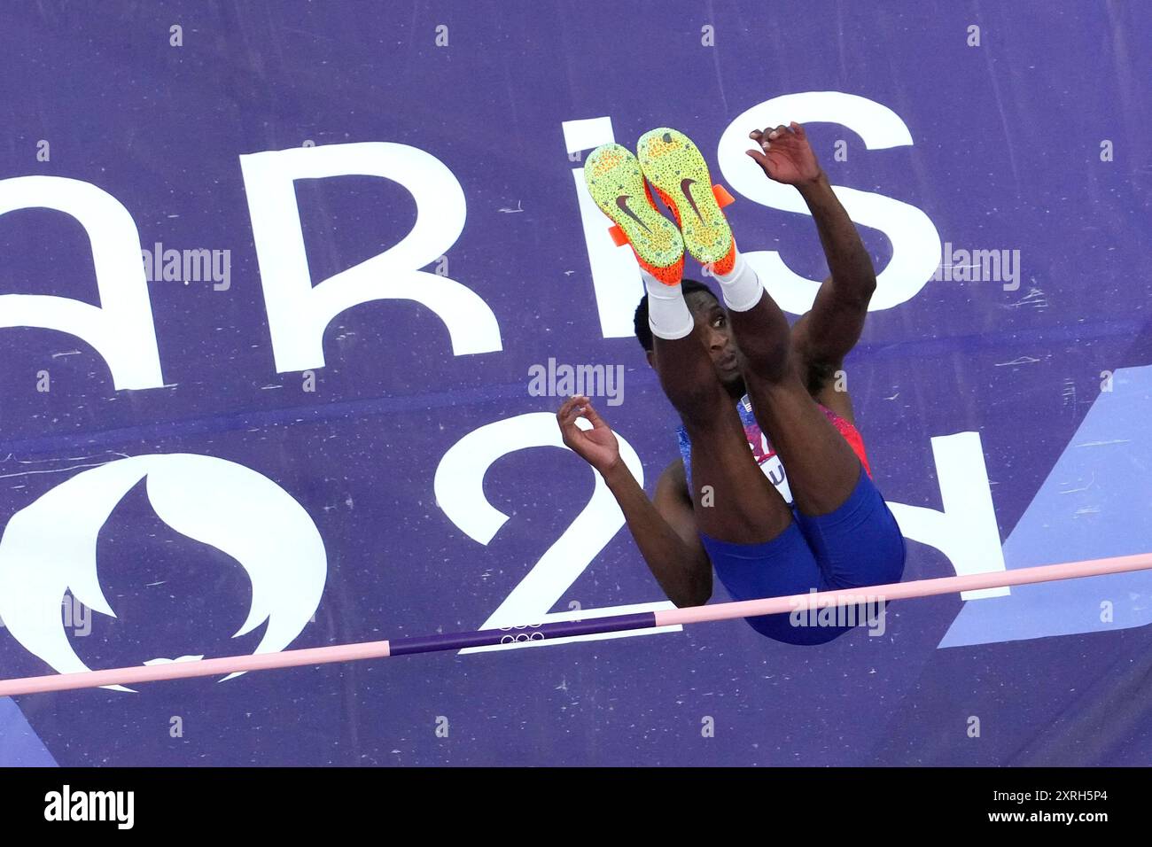 Shelby McEwen, of the United States, clears the bar in the men's high ...