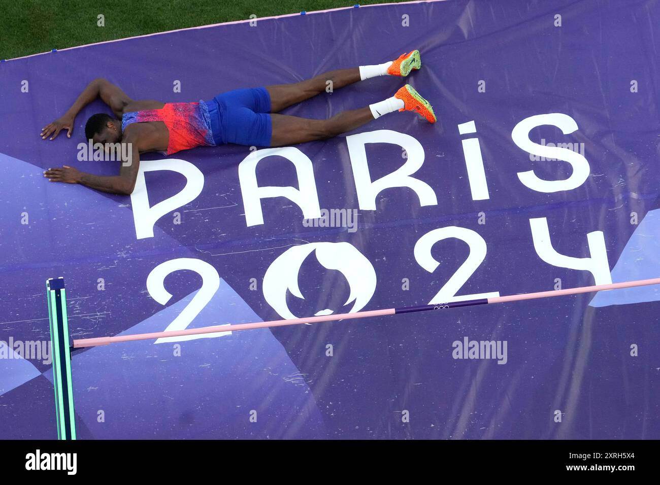 Shelby McEwen, of the United States, celebrates after clearing the bar ...