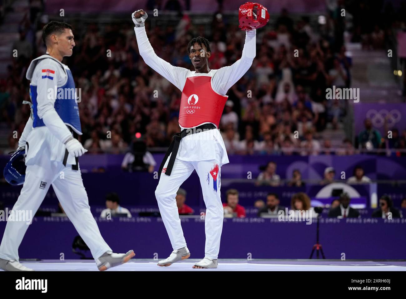 Cuba's Rafael Alba celebrates after winning the men's +80kg Taekwondo ...