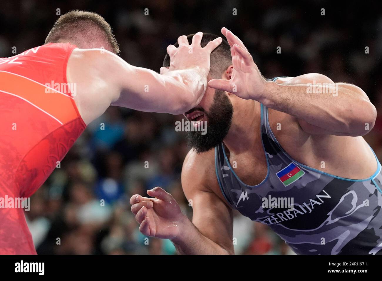 Poland's Robert Baran, in red, and Azerbaijan's Giorgi Meshvildishvili ...