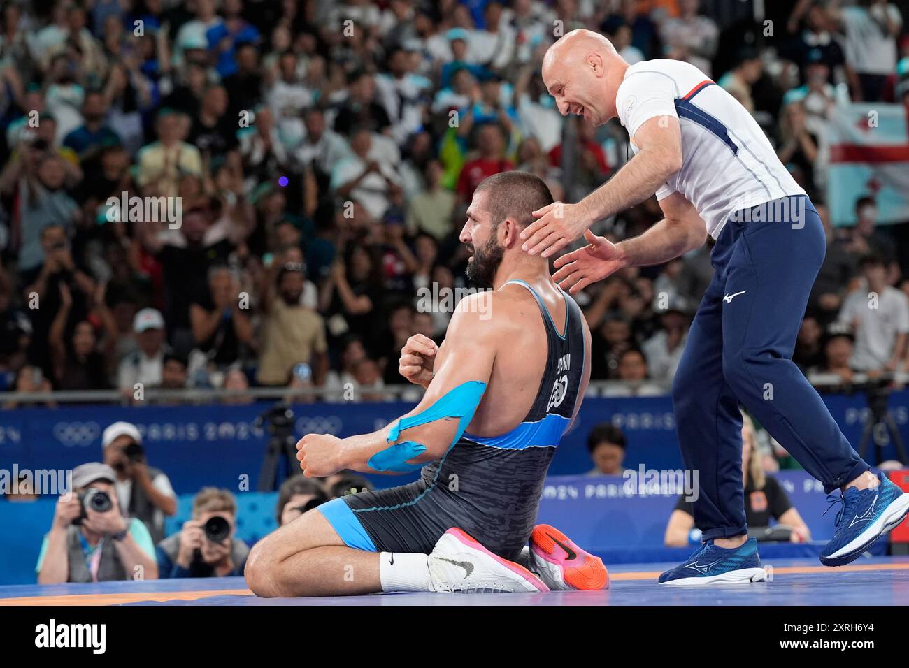 Georgia's Geno Petriashvili celebrates after defeating Iran's Amir ...